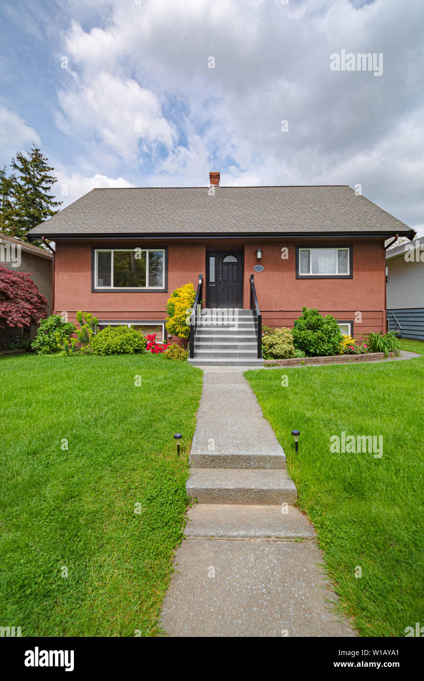 Average residential house built on land terrace Stock Photo - Alamy