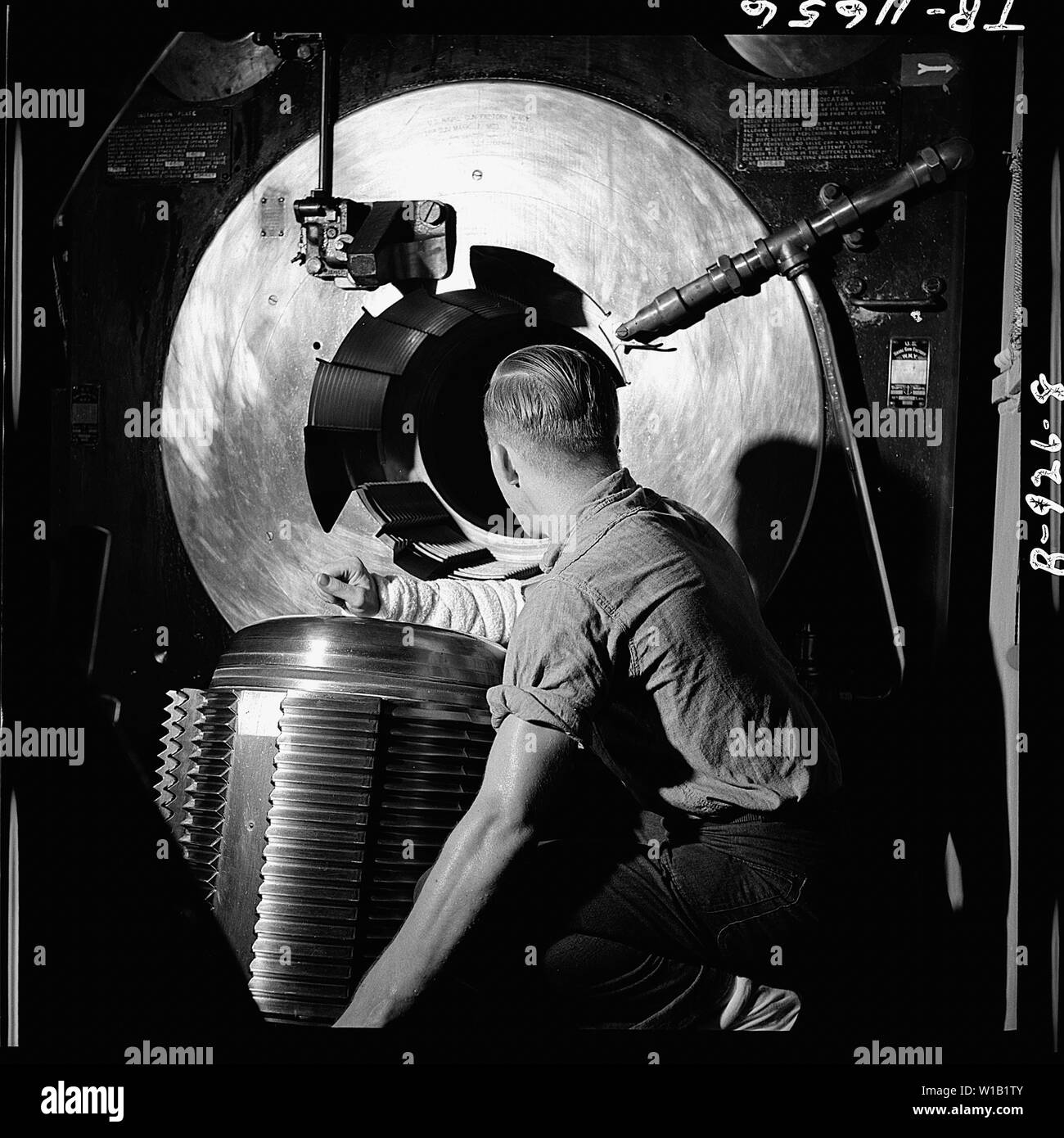 Barbette of 16 gun on board the USS New Jersey (BB-62). Gunner lowers ...