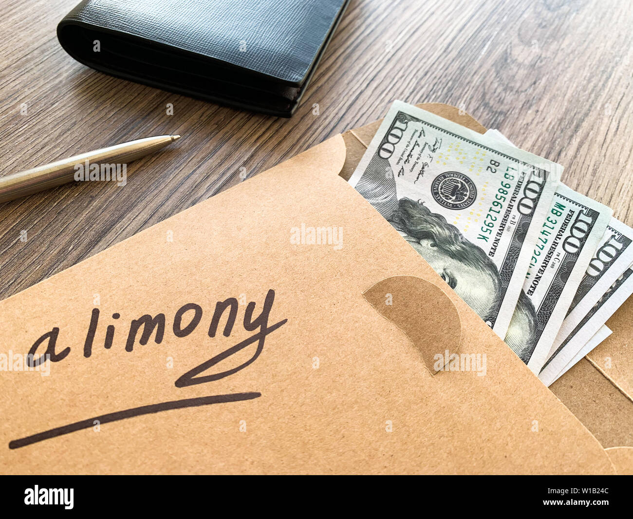 Divorce and separation concept. Alimony written on an envelope with ...