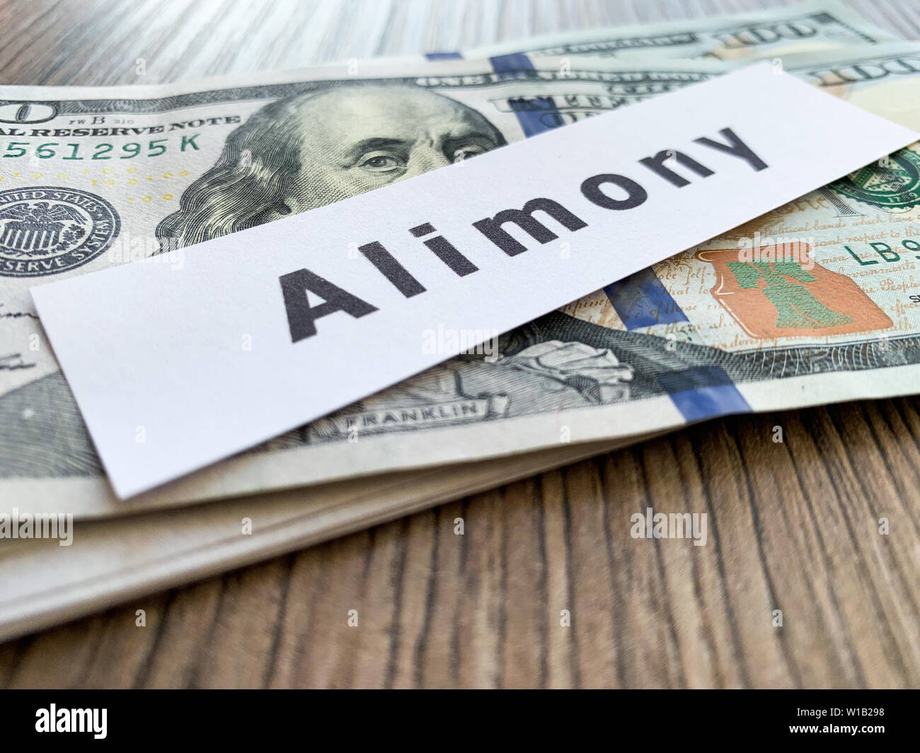 Payments alimony. Pile Dollars with sign alimony and money. Divorce and ...