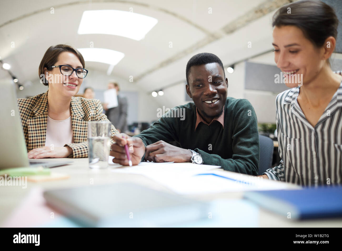 Happily working hi-res stock photography and images - Alamy