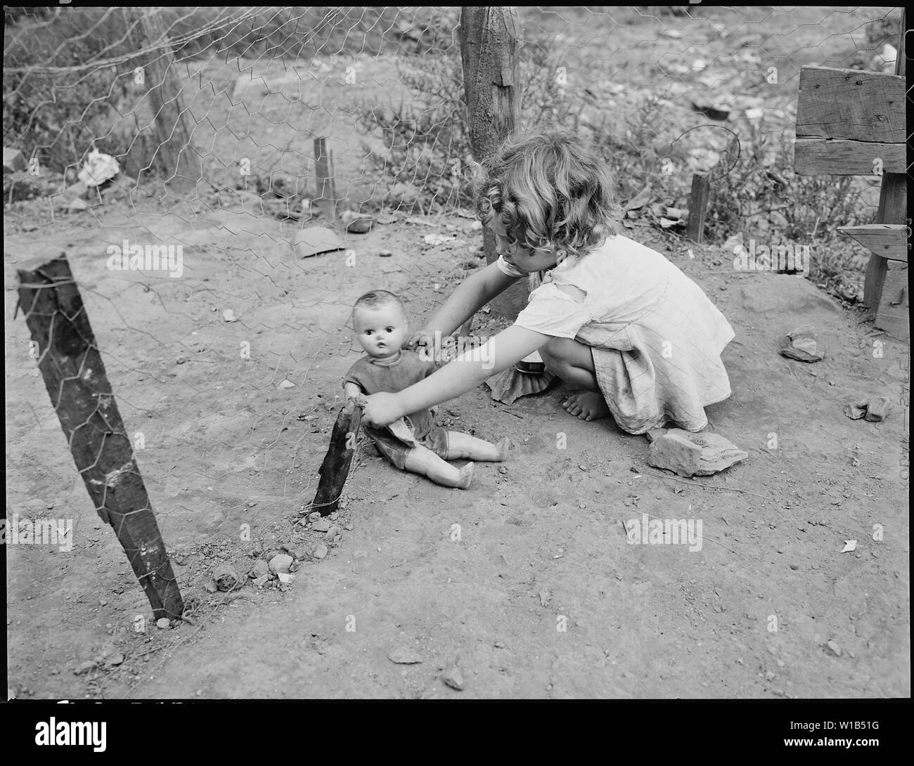 Bobbie Jean Sergent playing in her front yard. P V & K Coal Company ...