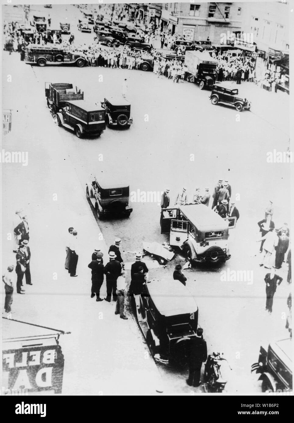 Bullet-riddled taxi and the bodies of two gangsters in a New York City ...