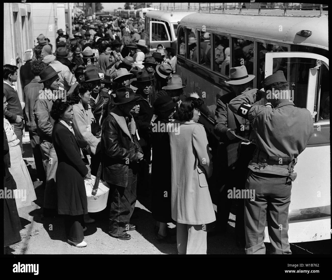 Byron, California. Farm families of Japanese ancestry boarding buses ...