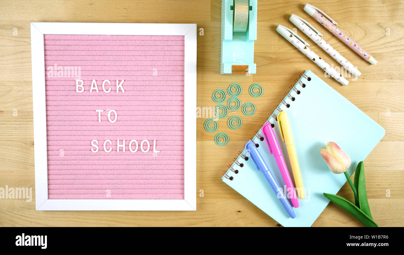 Pink notice board with Back to School message flatlay Stock Photo - Alamy