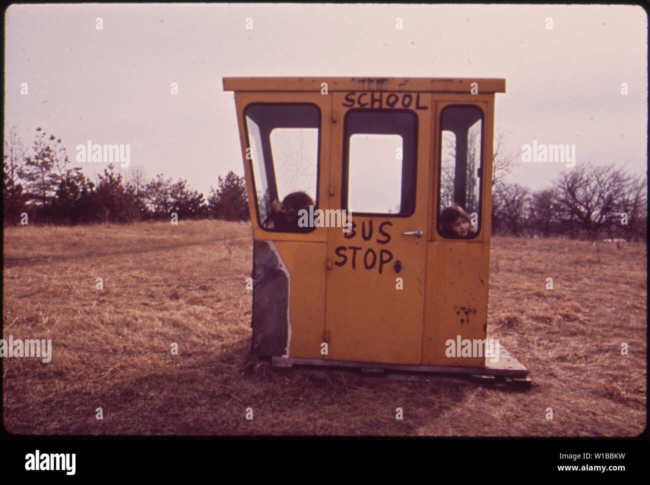 CHILDREN PLAYING IN RURAL SCHOOL BUS STOP Stock Photo - Alamy
