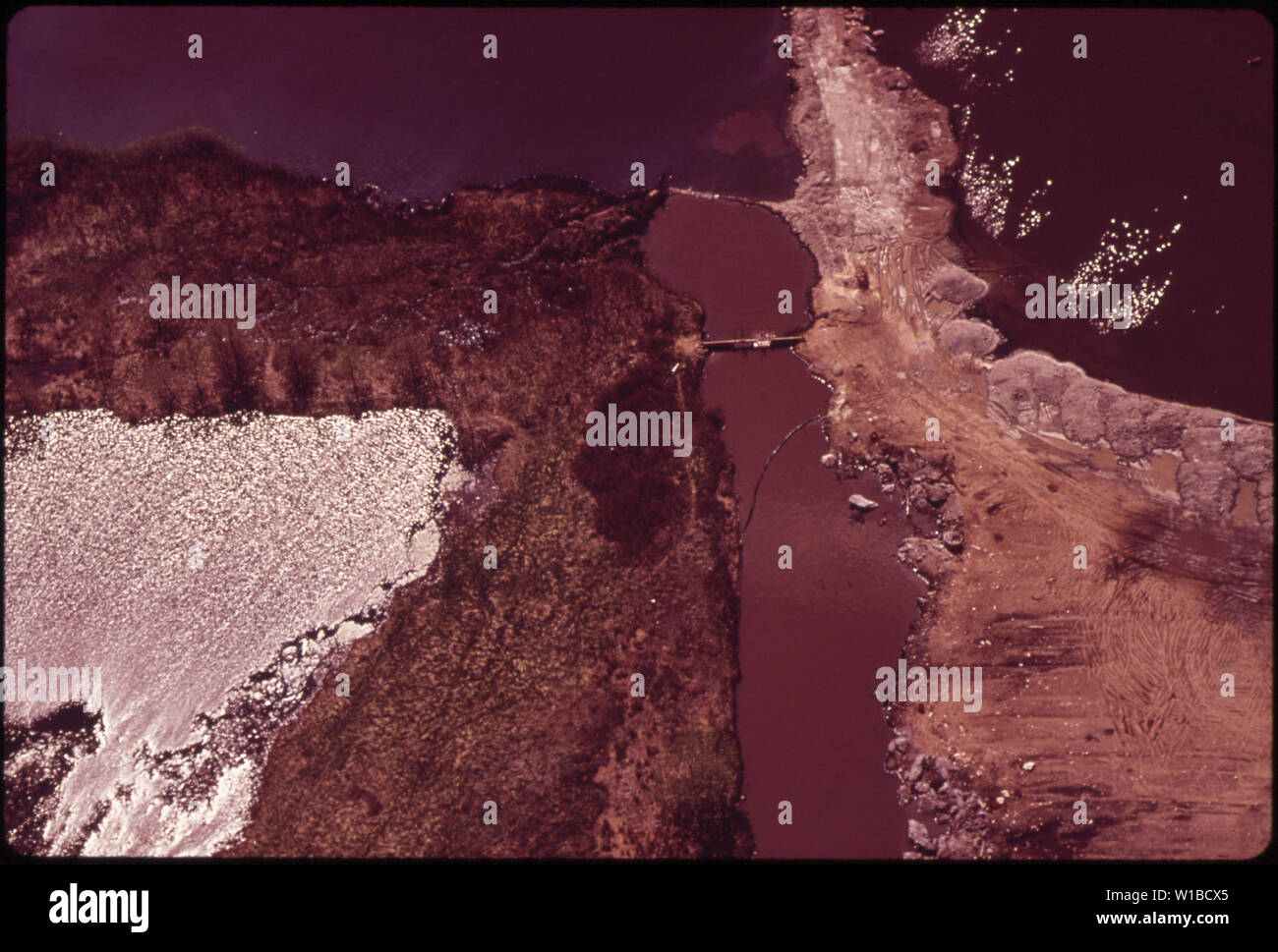 CLEAR WATER AND DISCOLORED WATER IN MARSHLAND Stock Photo - Alamy