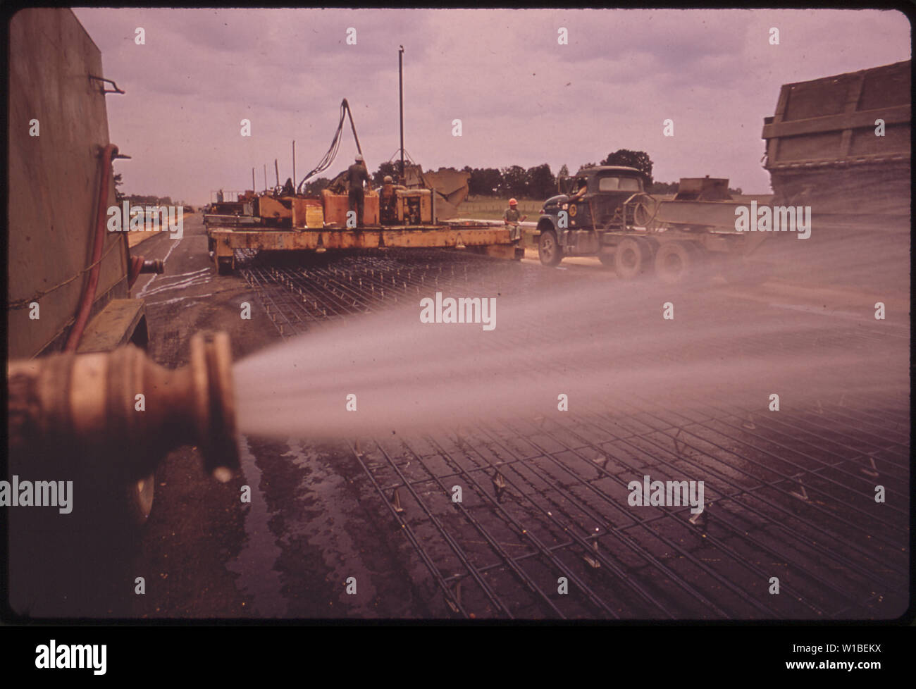 CONSTRUCTION OF I-55, NORTH OF DURANT. WATER IS BEING SPRAYED ON ...