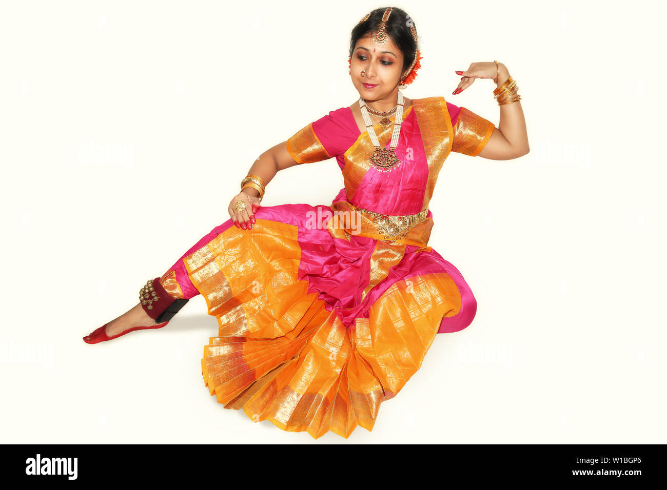 Young beautiful Indian woman dancer performing Bharatanatyam classical ...