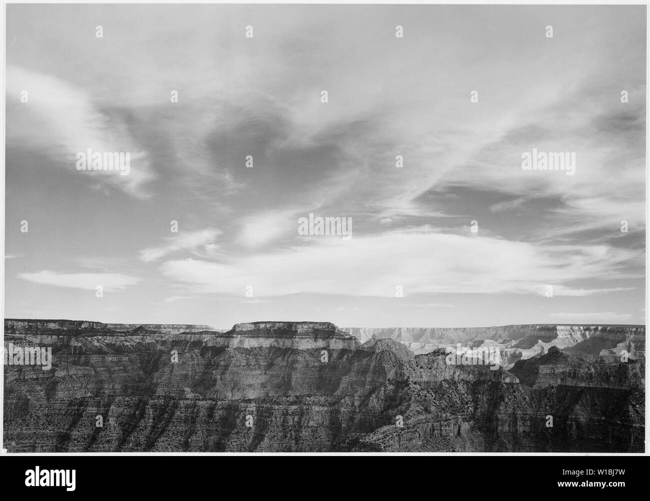 Canyon edge, low horizon, clouded sky, Grand Canyon National Park ...