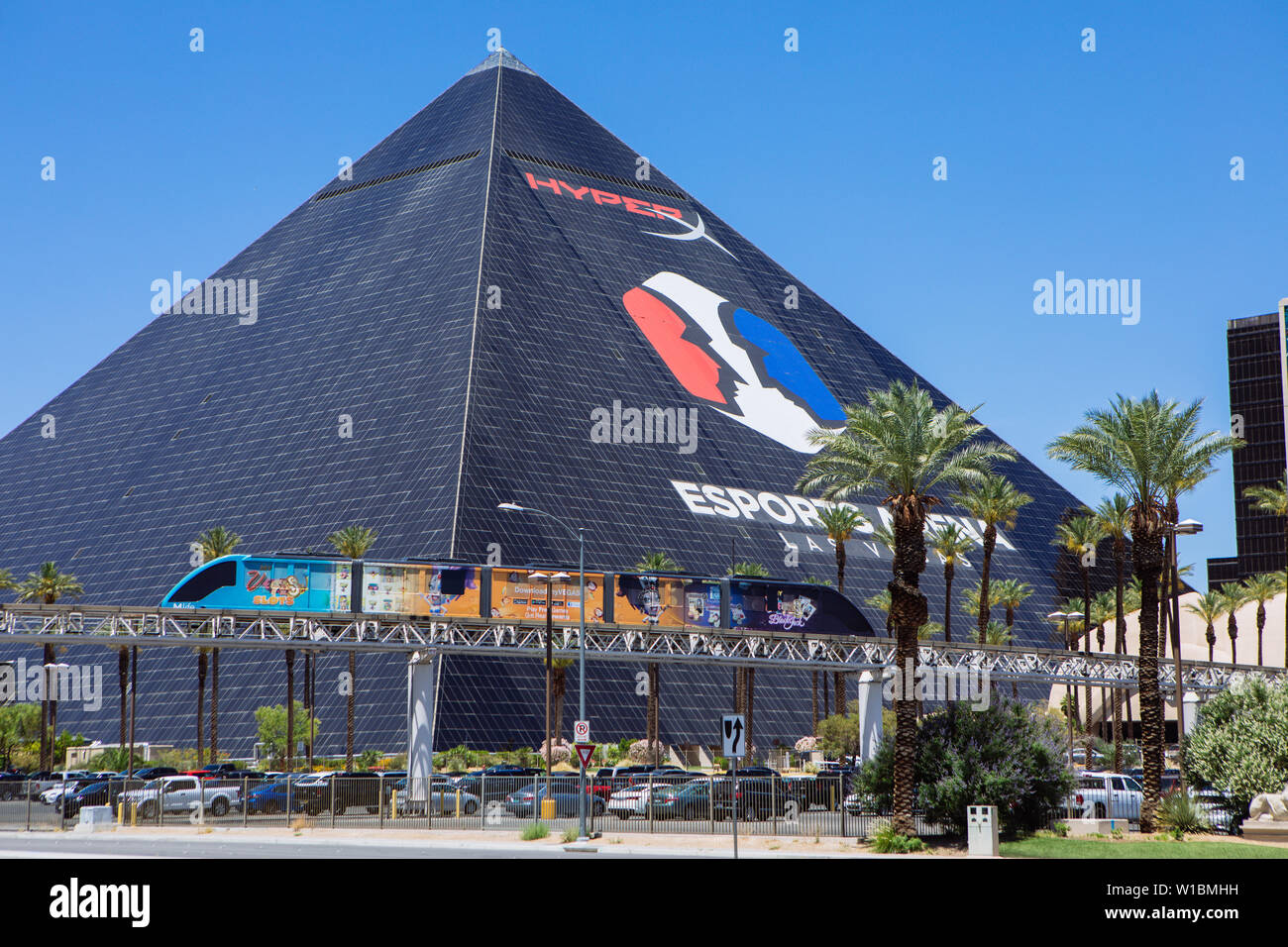 Las Vegas Monorail tram passing by the front of Esports Arena facade in ...