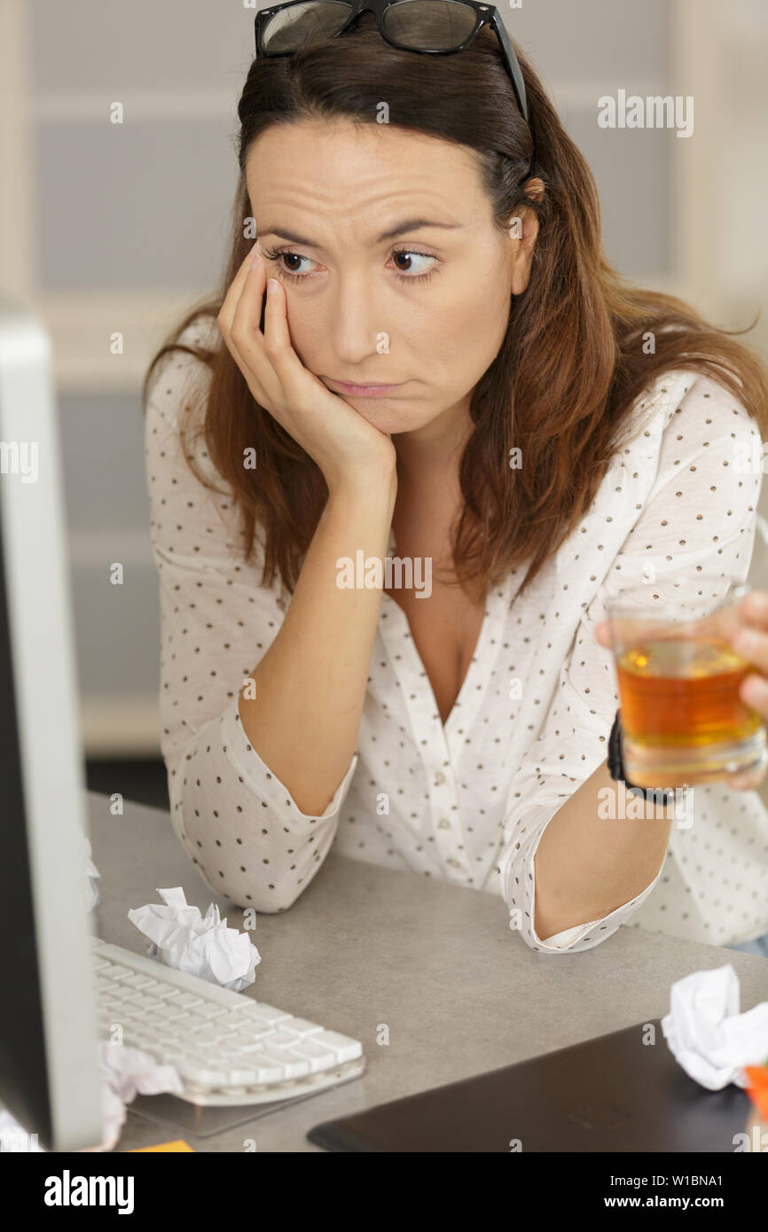 Hiding alcohol at work desk hi-res stock photography and images - Alamy
