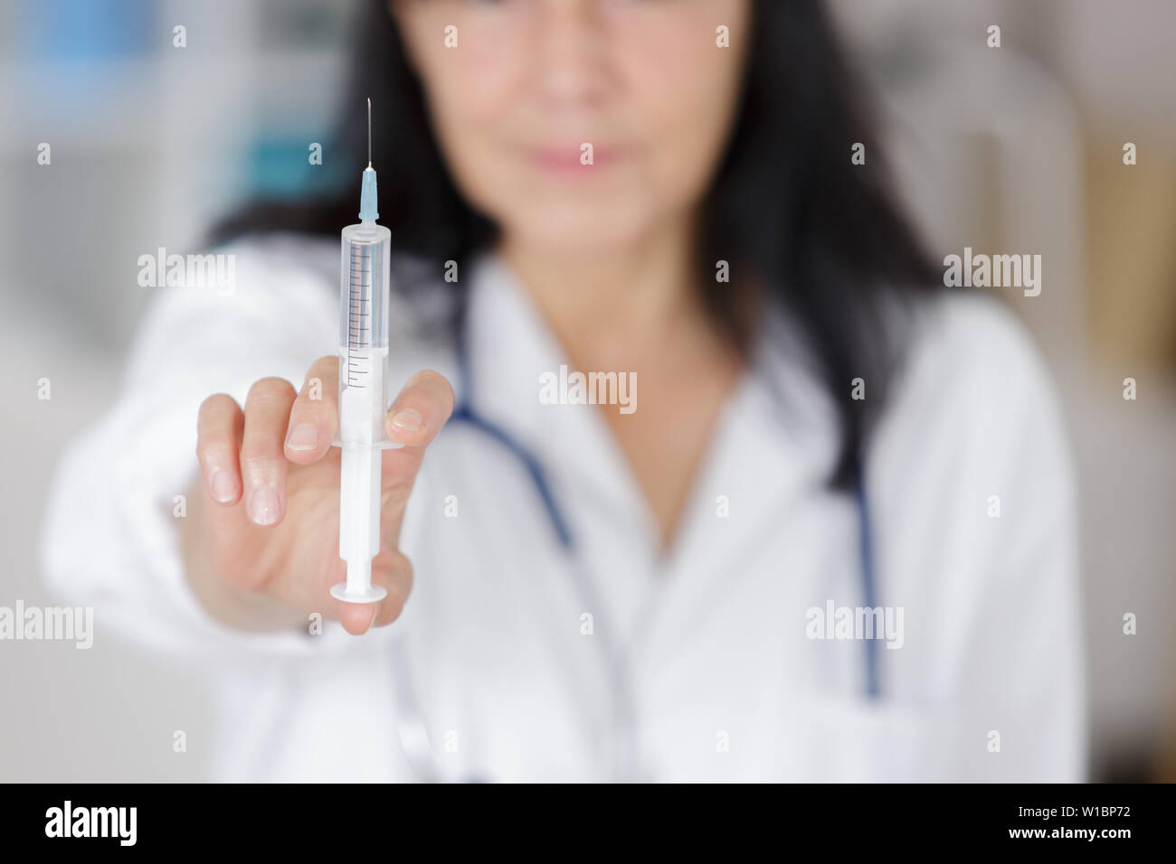 doctor showing hand press syringe Stock Photo - Alamy