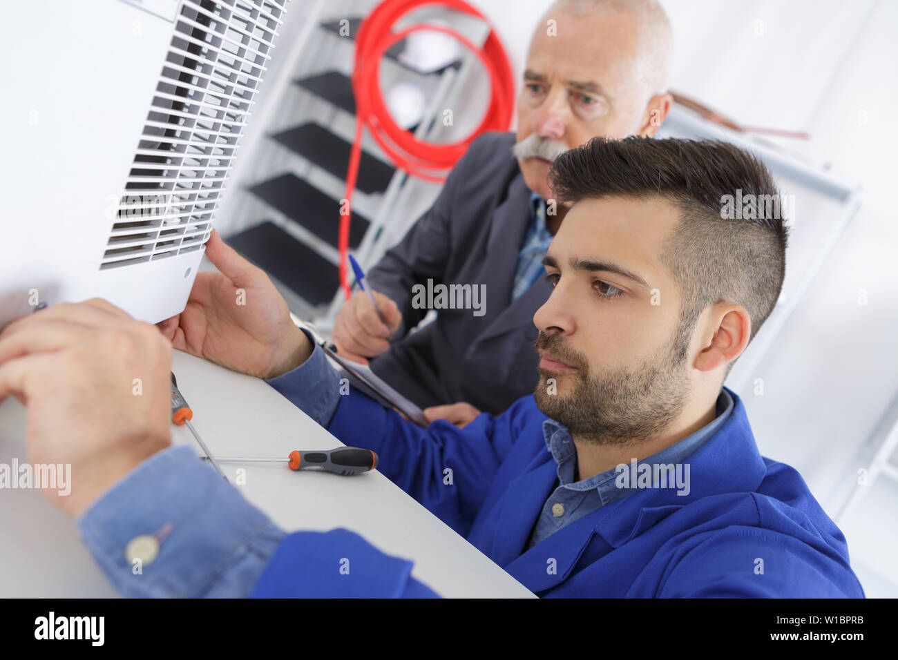 air conditioning technician at work Stock Photo - Alamy