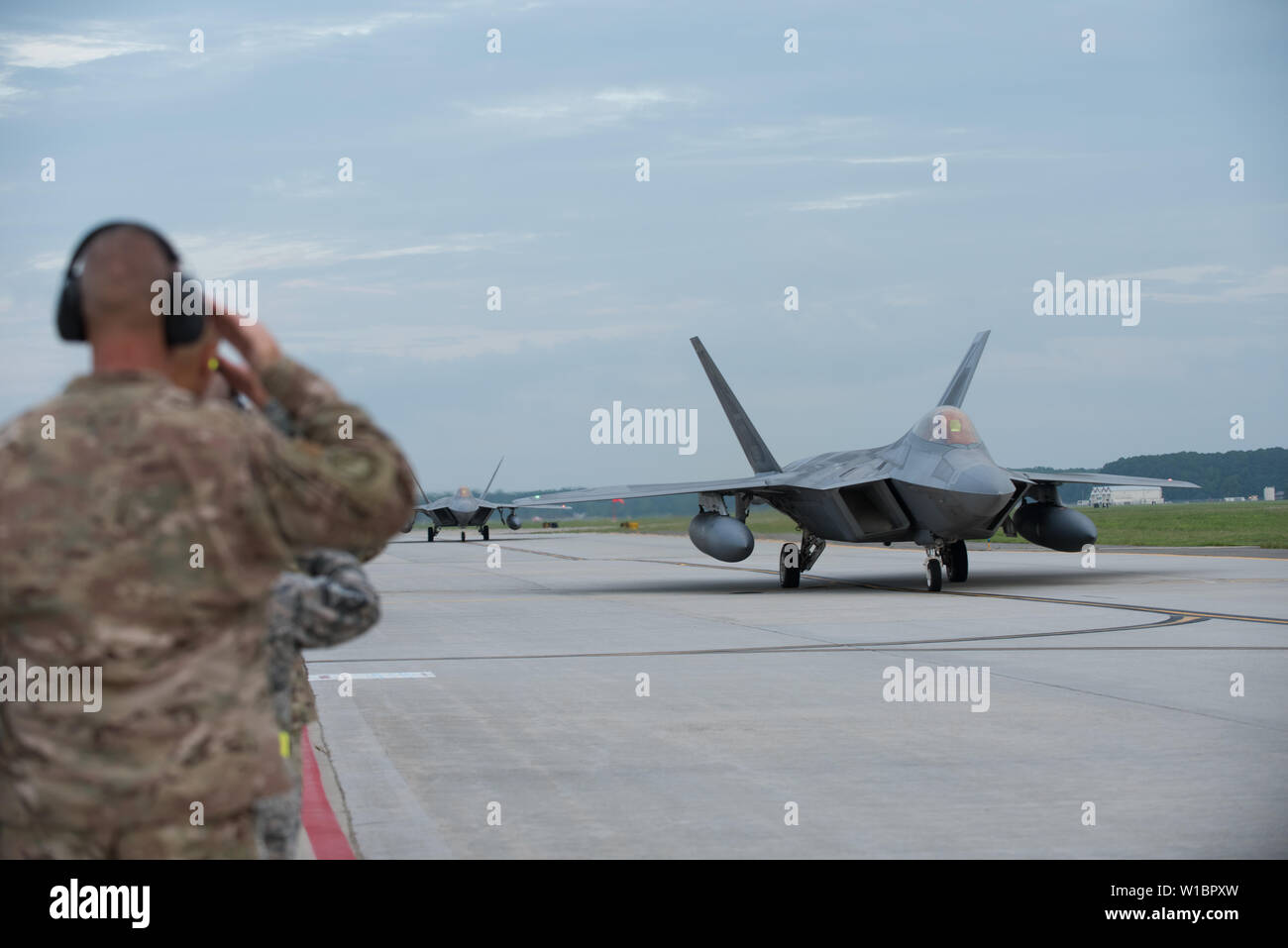 Maintainers and senior leaderships from the 1st Fighter Wing salute F ...