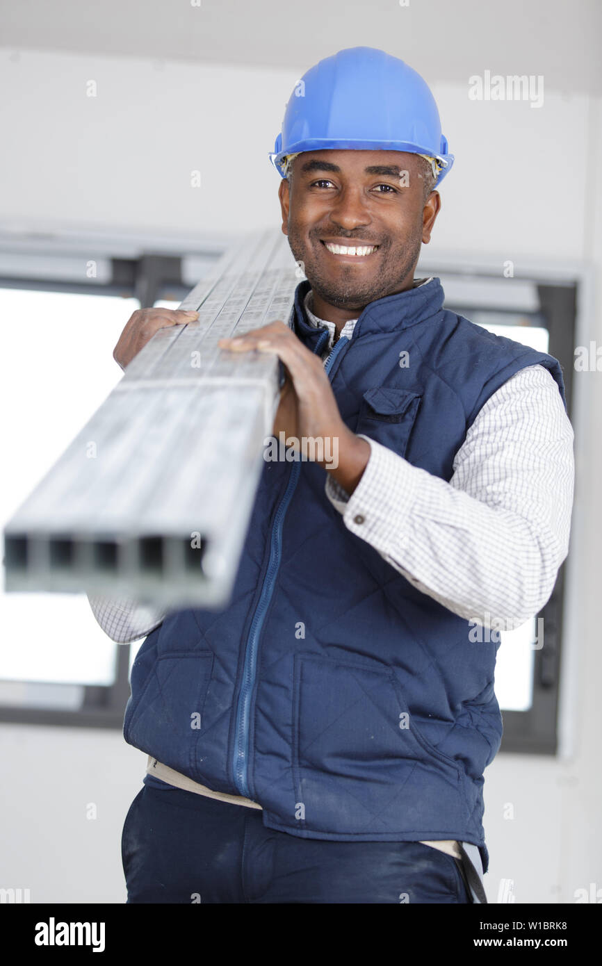 Worker carrying rebar hi-res stock photography and images - Alamy