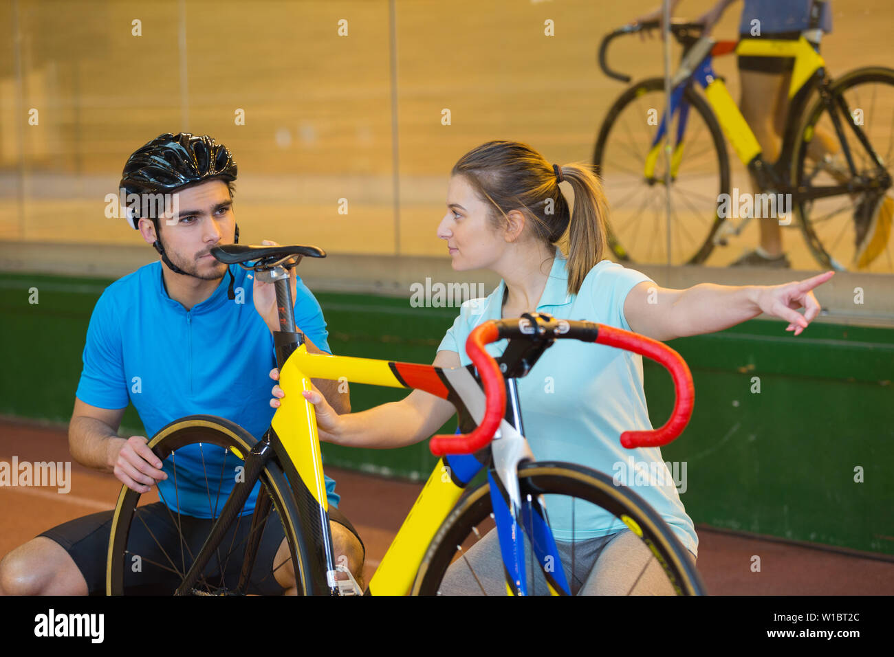 coach and male cyclist training in the velodrome Stock Photo - Alamy