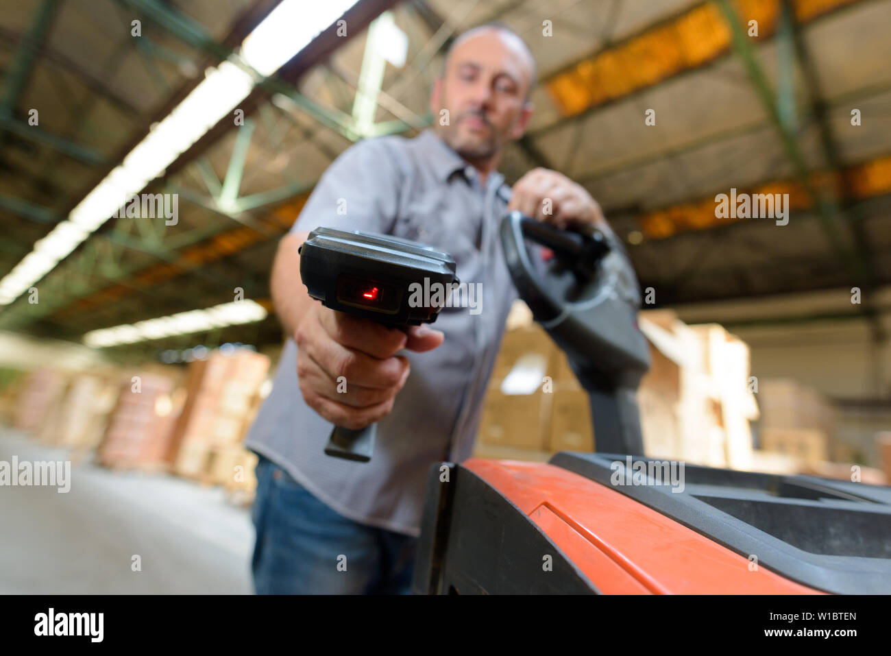 portrait of a man holding scanner Stock Photo - Alamy