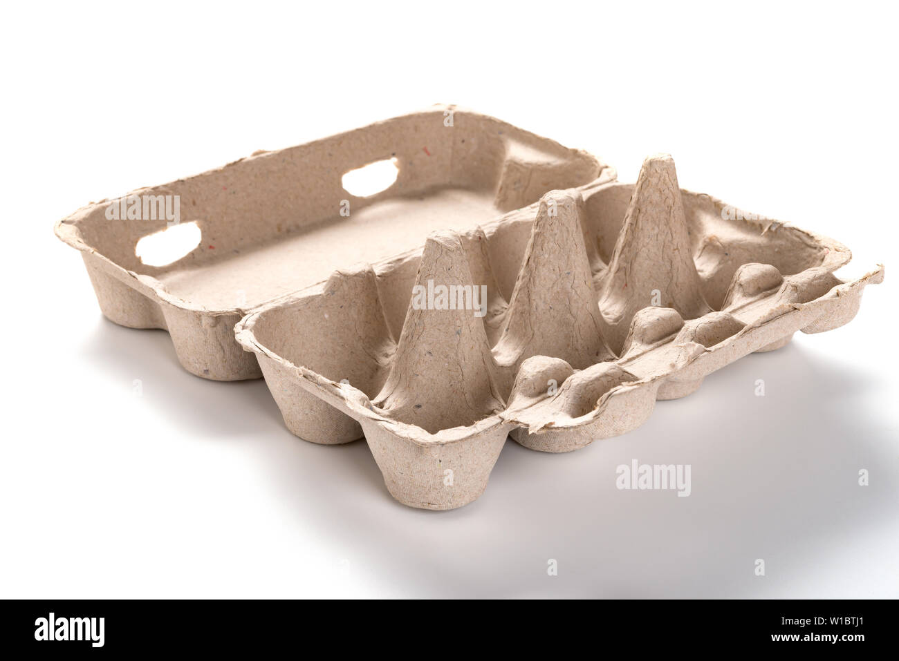 side view empty egg case on white background Stock Photo - Alamy