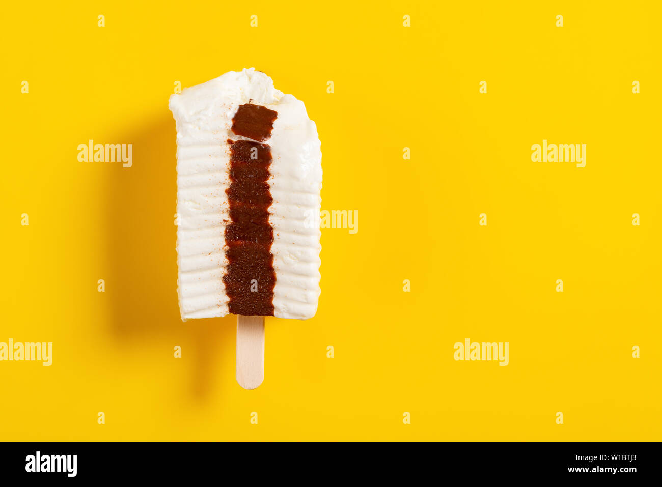top view fresh chocolate and milkshake flavor popsicle with some bites ...
