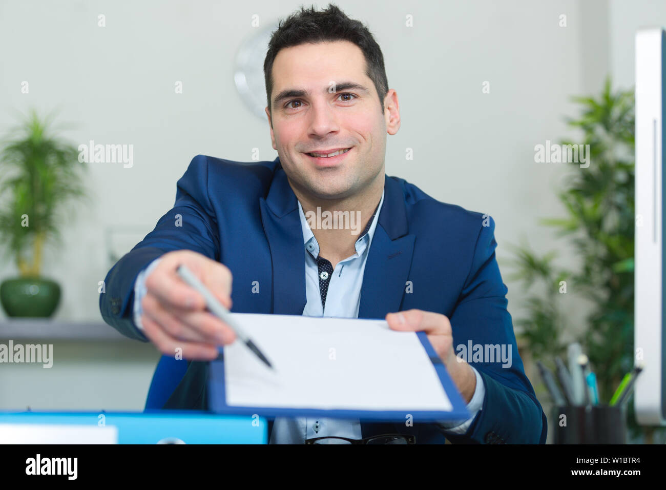 man asking for signature Stock Photo - Alamy
