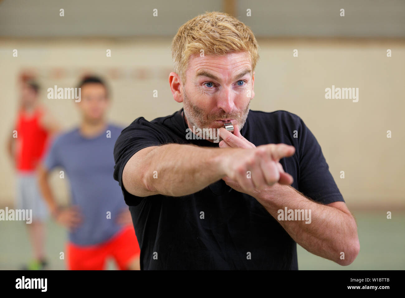 professional soccer referee pointing at something Stock Photo - Alamy