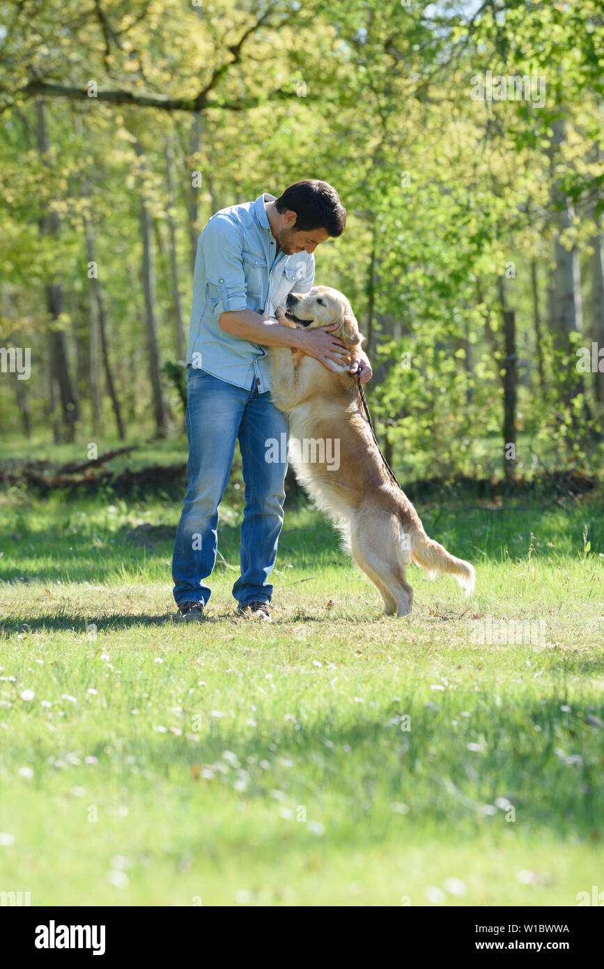a man playing with dog Stock Photo - Alamy