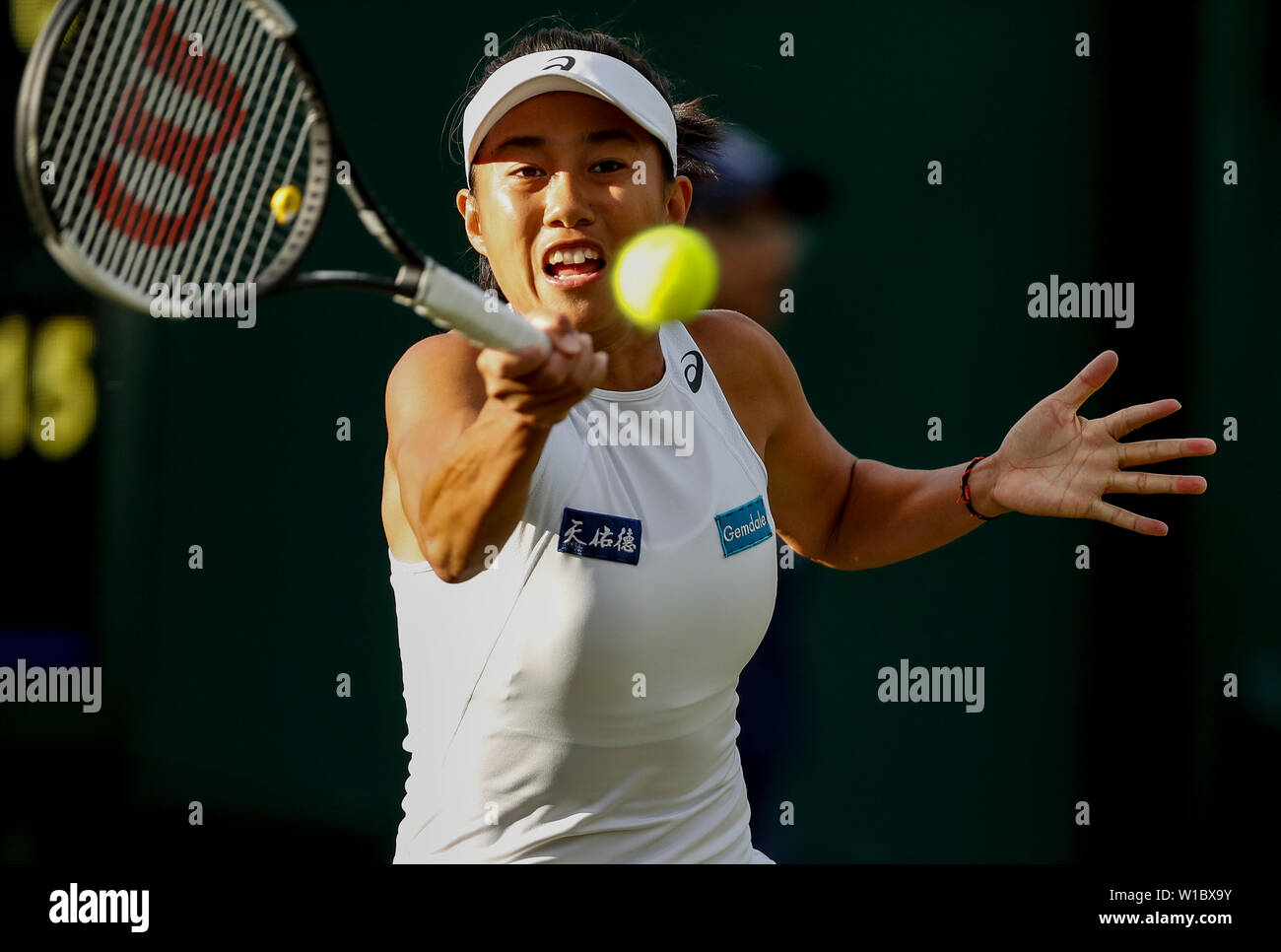 London, Britain. 1st July, 2019. Zhang Shuai of China returns a shot ...