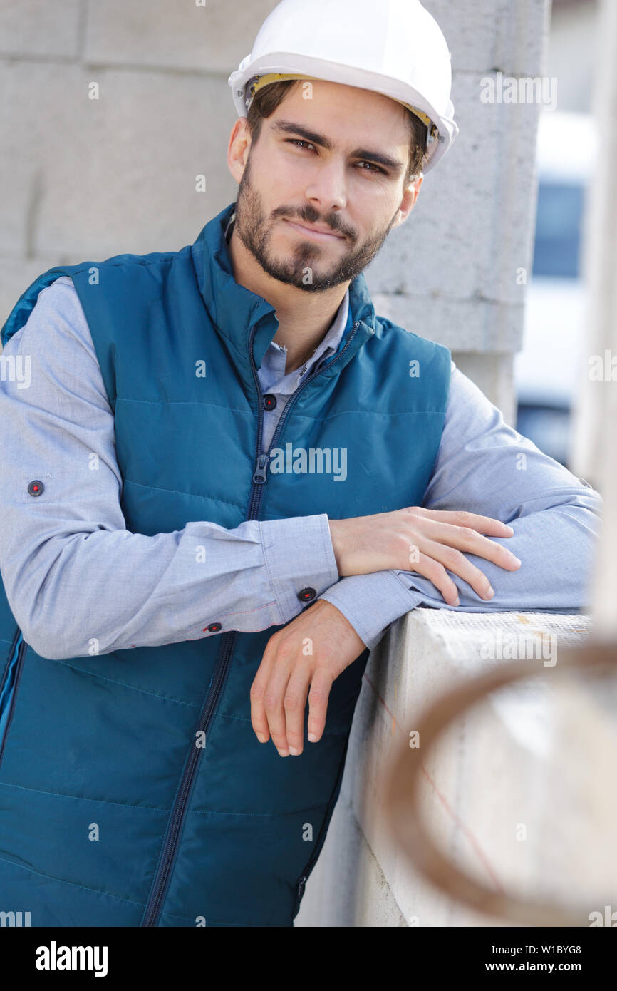 young attractive and confident builder looking at camera Stock Photo ...