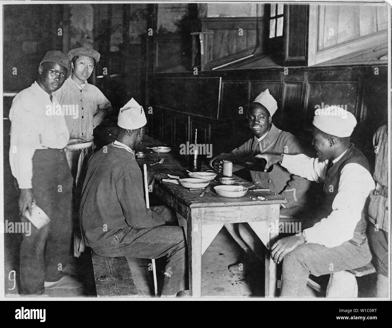 Convalescent Moroccan and Chinese workmen at mess in hospital at Dinan ...
