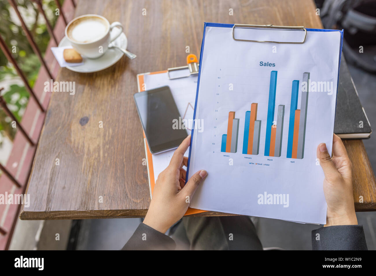 Close up photo of human hands holding sale chart document Stock Photo ...