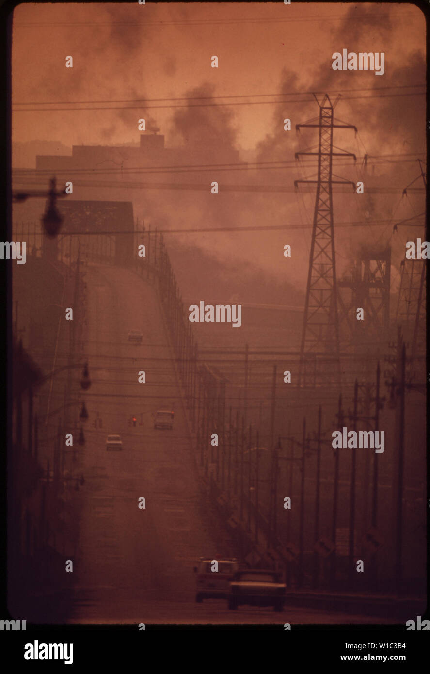 DARK CLOUDS OF FACTORY SMOKE OBSCURE CLARK AVENUE BRIDGE Stock Photo ...