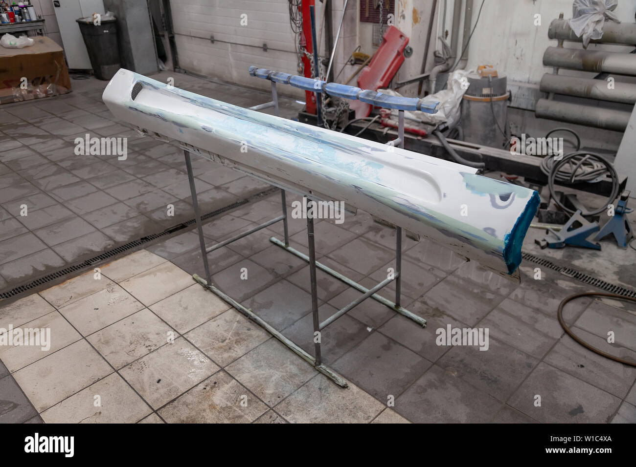 Painting and drying in professional box of car body parts after ...