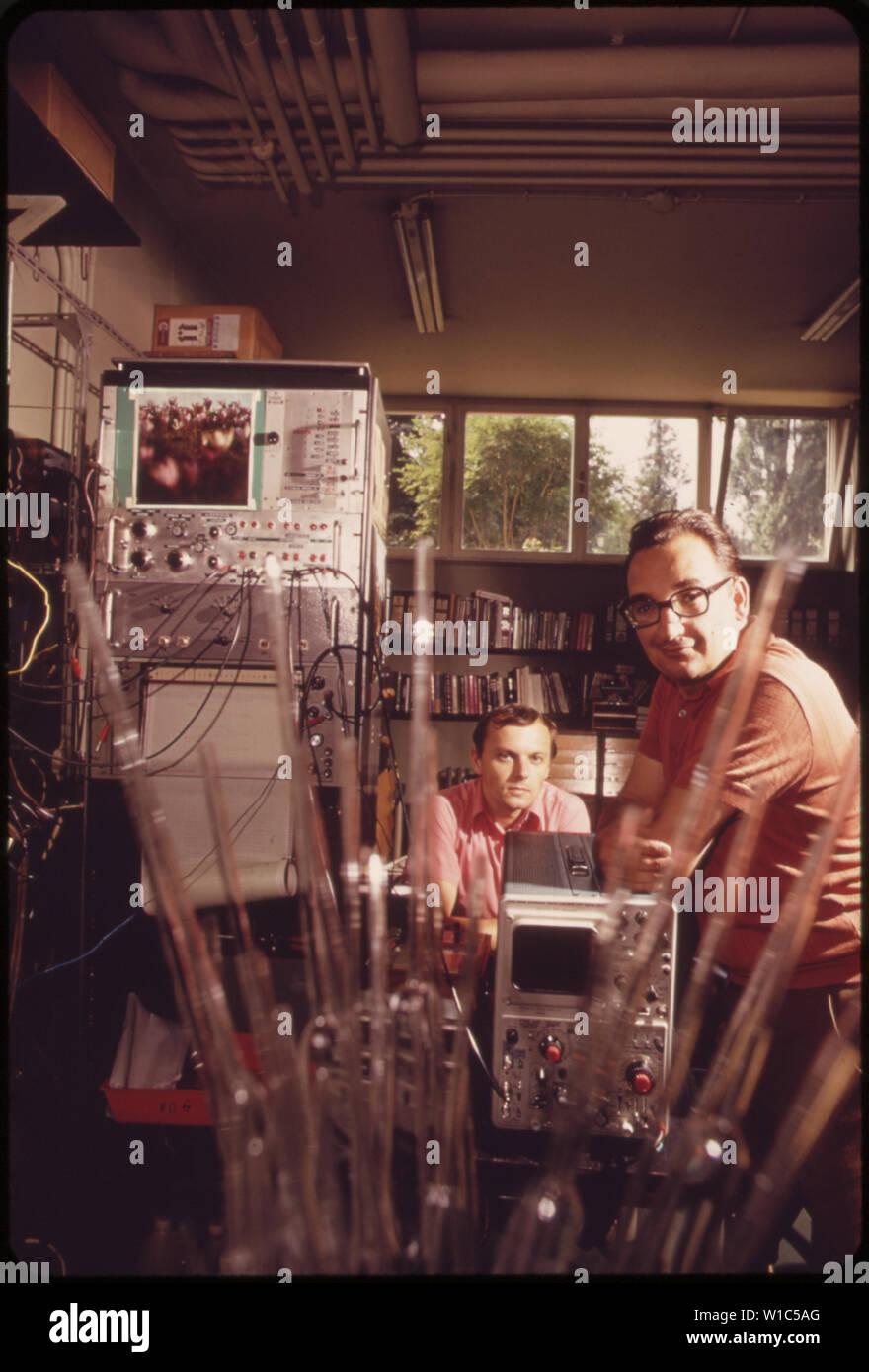 DR. VELIMIR PRAVDIC, CHIEF OF THE ELECTRO-CHEMISTRY LAB (RIGHT), AND ...