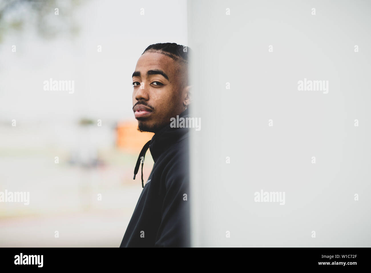 Man wearing hoddie hi-res stock photography and images - Alamy