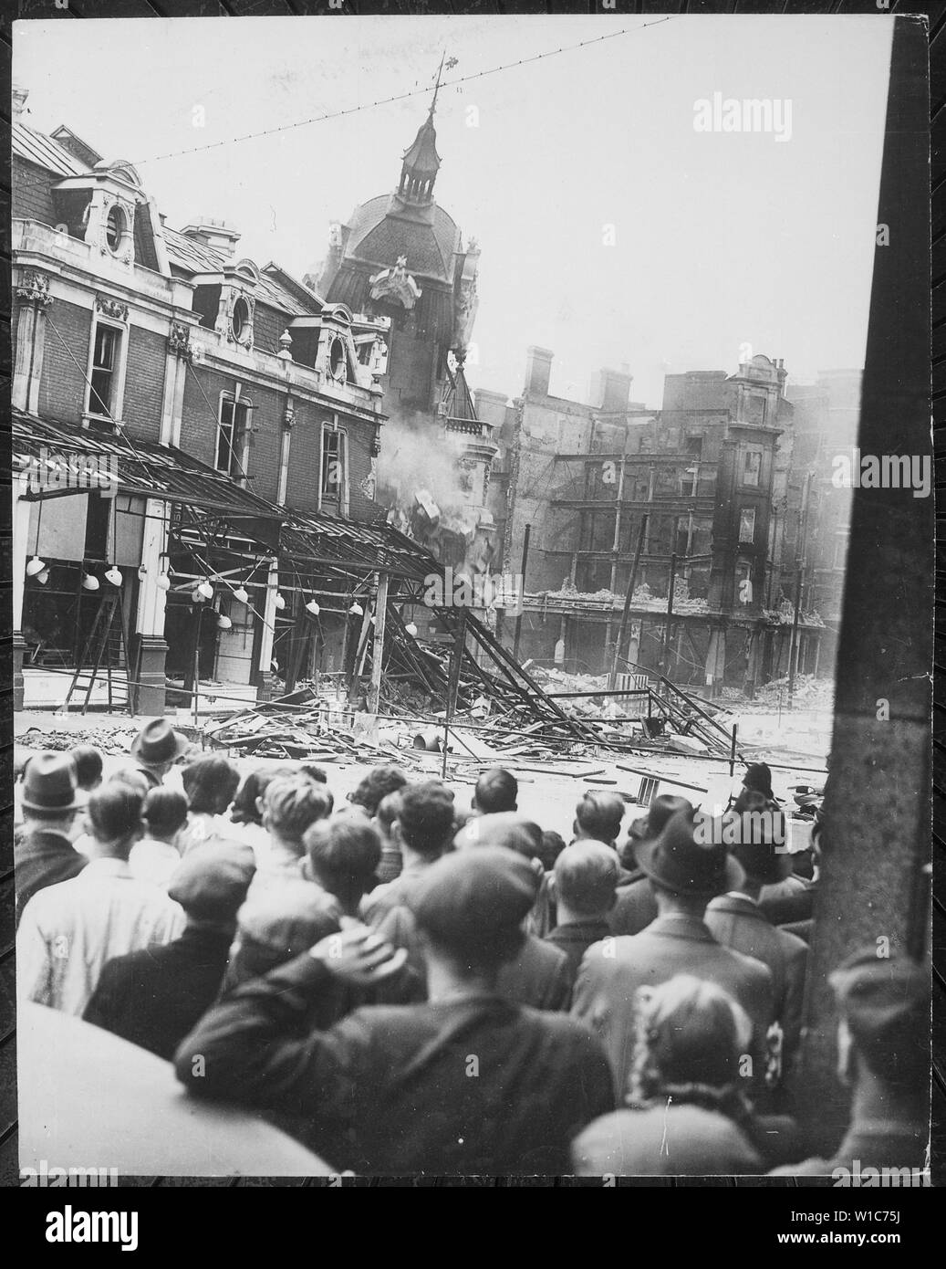Demolishing a tower in London's Smithfield Market which was unsafe ...