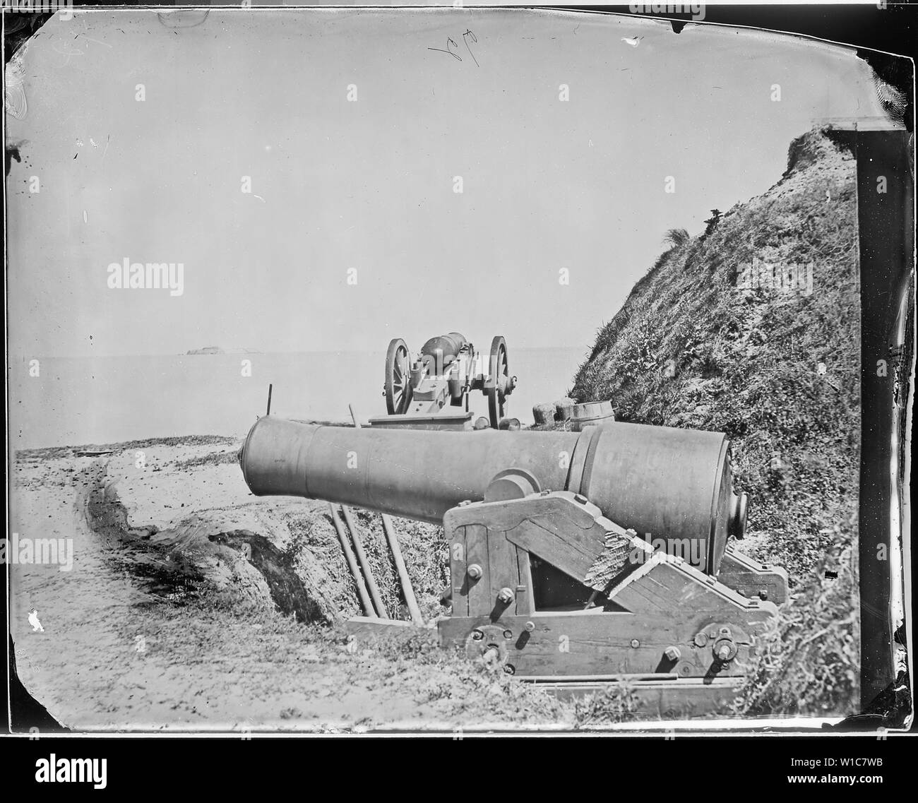 Distant view of Fort Sumter, 1865; The foreground weapon is a 10-inch Model 1844 columbiad ...
