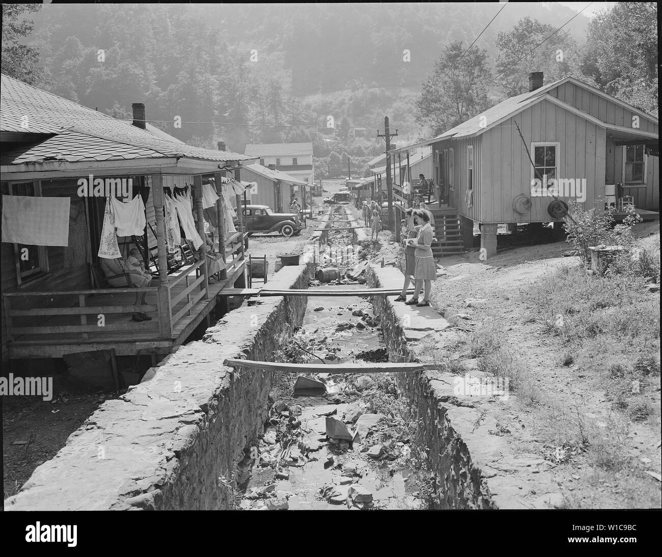 Double row houses; garbage and trash are disposed of in this meager ...