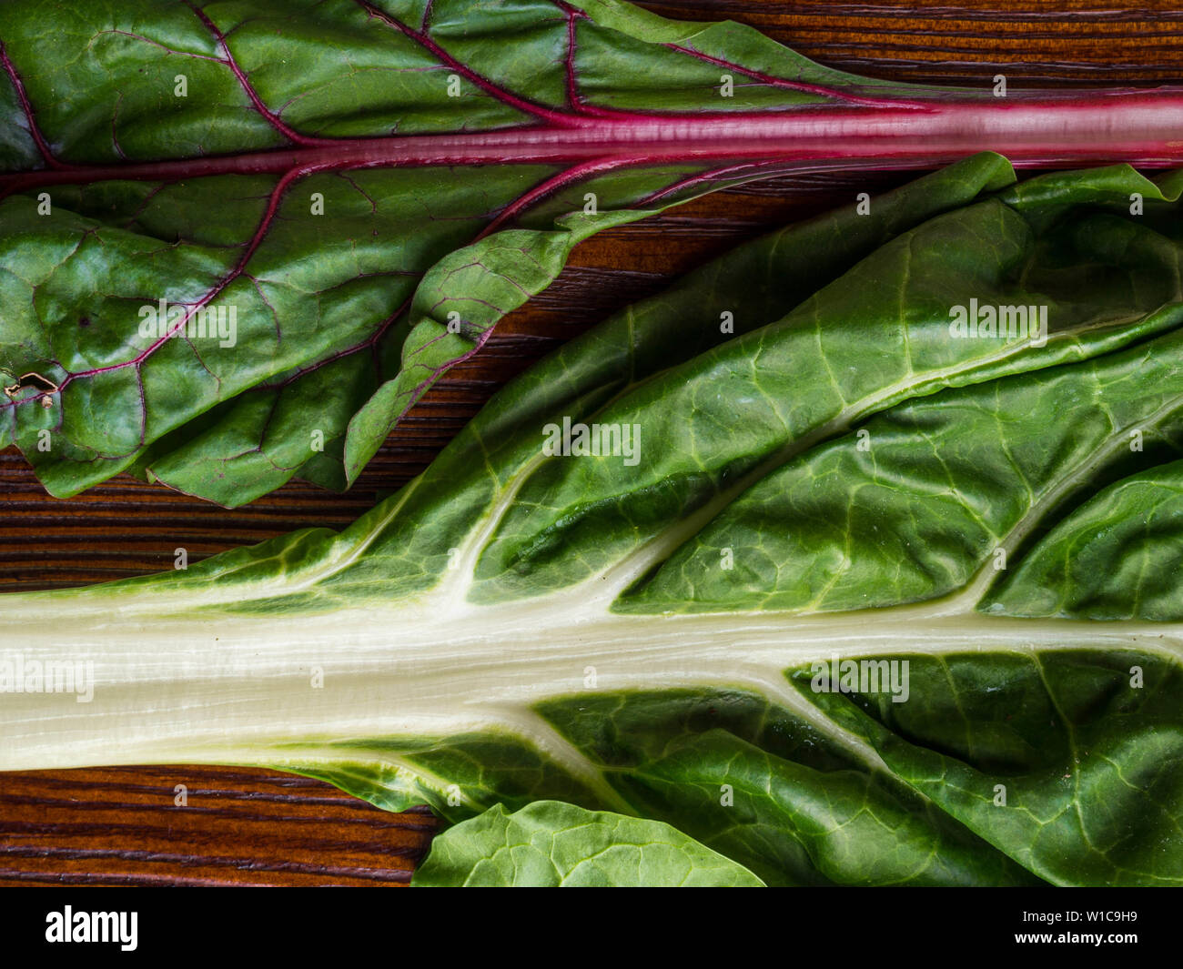Raw mangold on wooden backgound, Fresh leaves of chard, close up, white ...