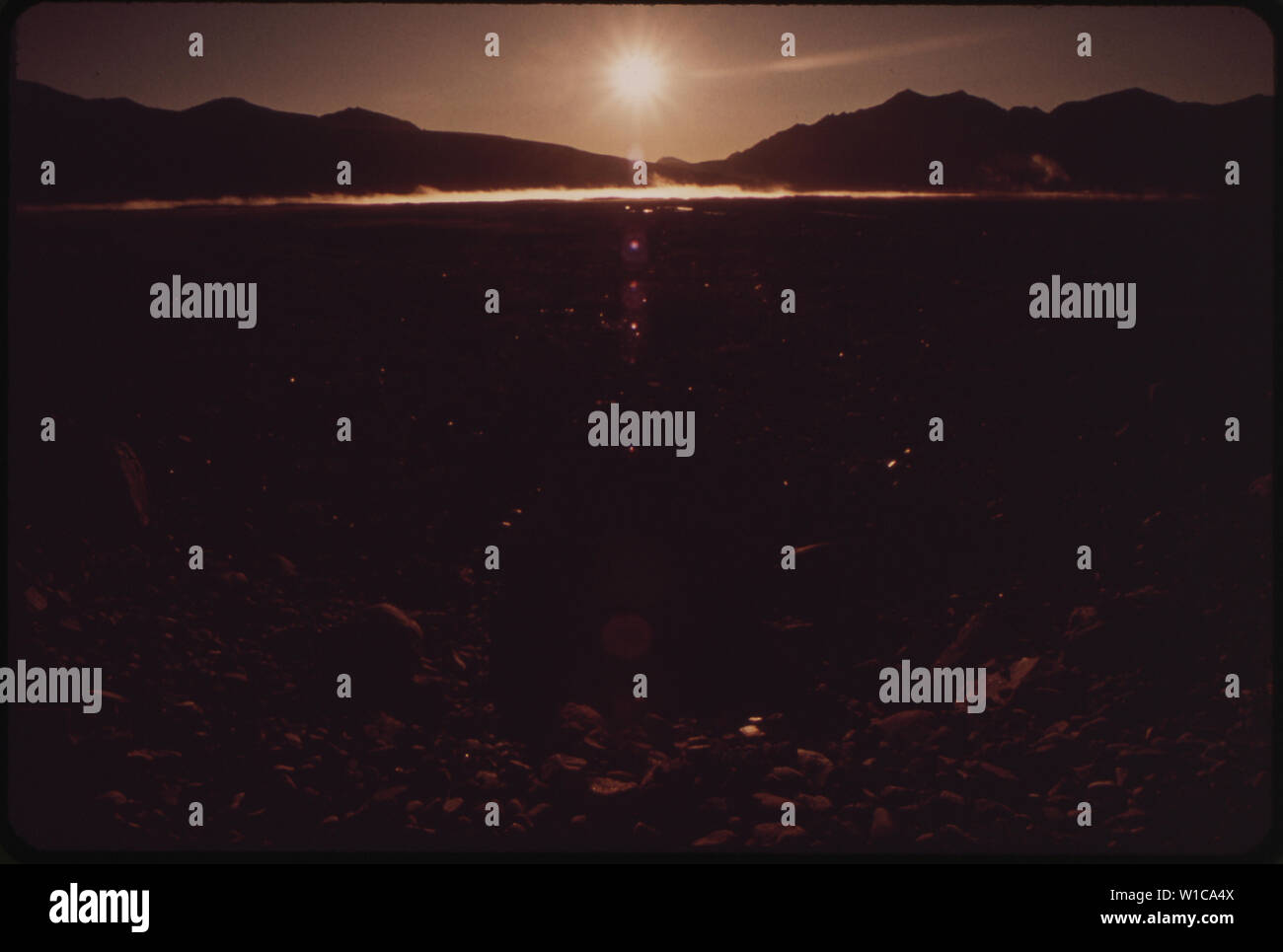 EARLY MORNING (5 A.M.) SUN OVER THE ATIGUN GORGE AND GALBRAITH LAKE ...