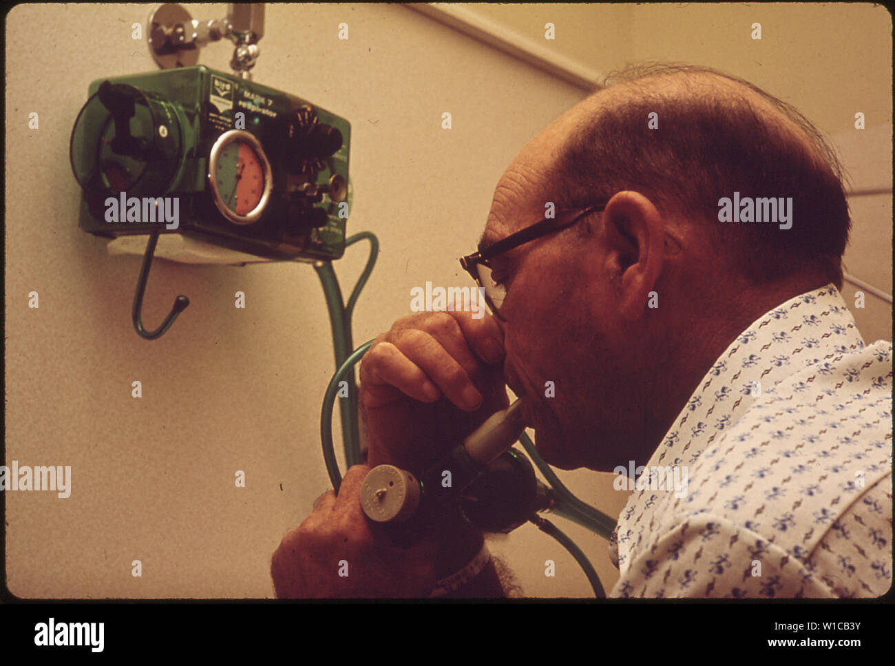 EMPHYSEMA PATIENT MR. GEORGE LEWIS USES A LUNG FUNCTION TESTING MACHINE ...