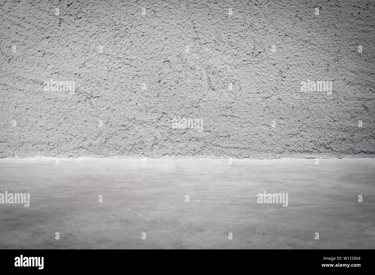 grunge concrete studio room background with light.mock up space for ...