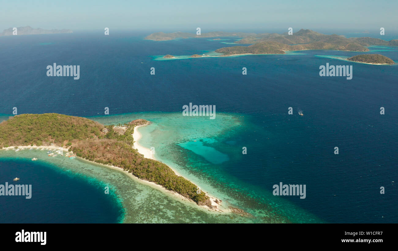 aerial view tropical islands with blue lagoons, coral reef and sandy ...