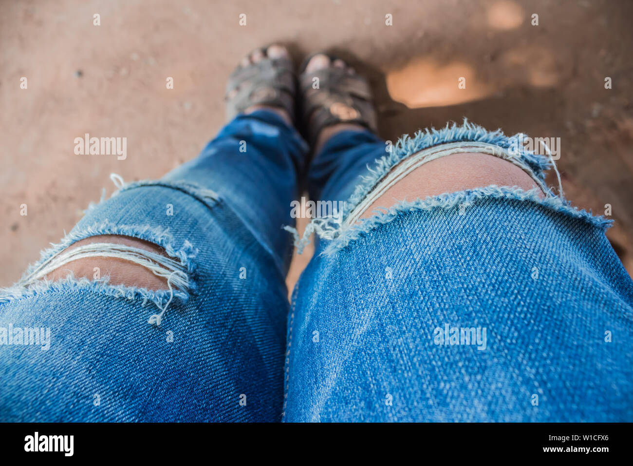 Torn jeans hi-res stock photography and images - Alamy
