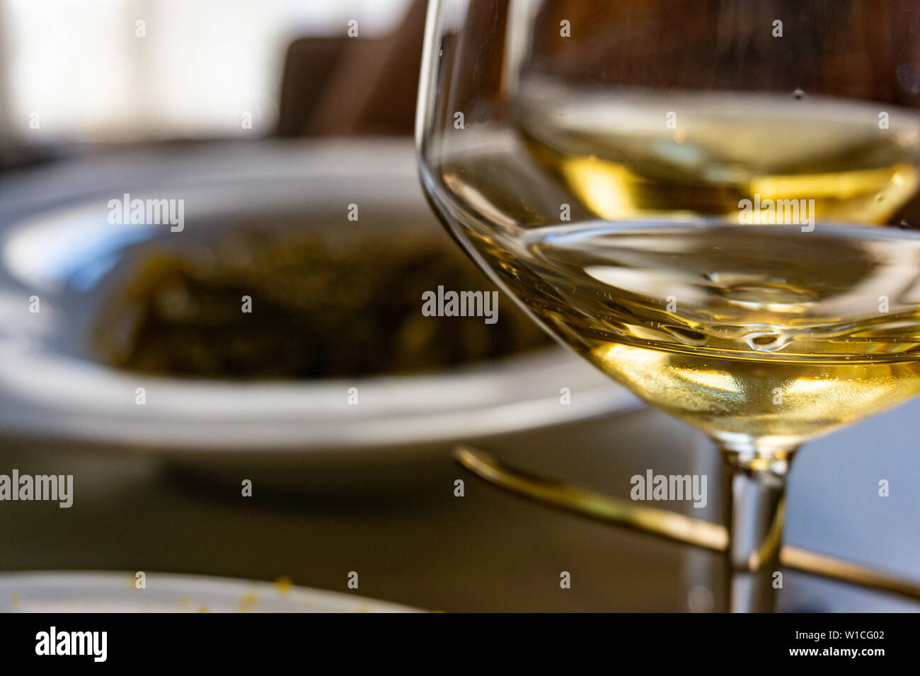 Serving a glass of white wine in a restaurant Stock Photo - Alamy