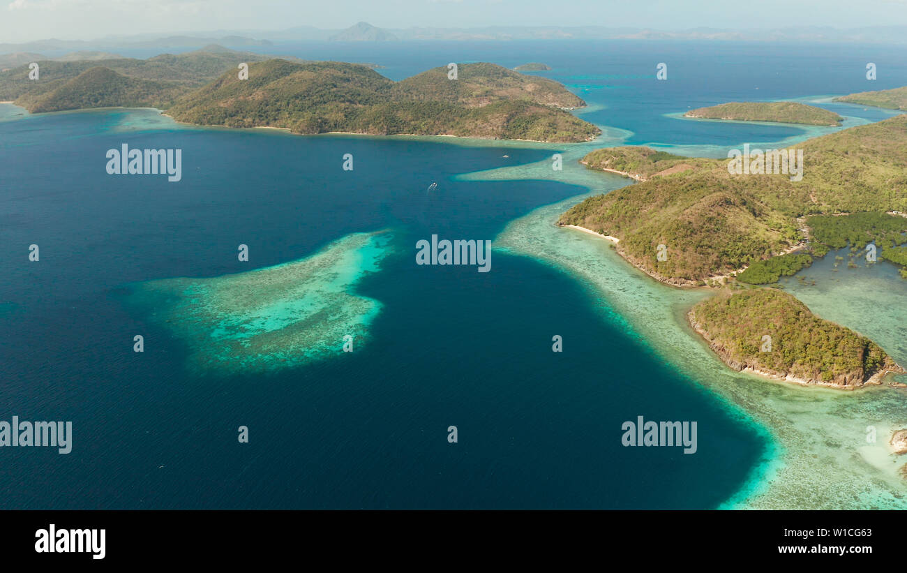 aerial view tropical islands with blue lagoon, coral reef and sandy ...