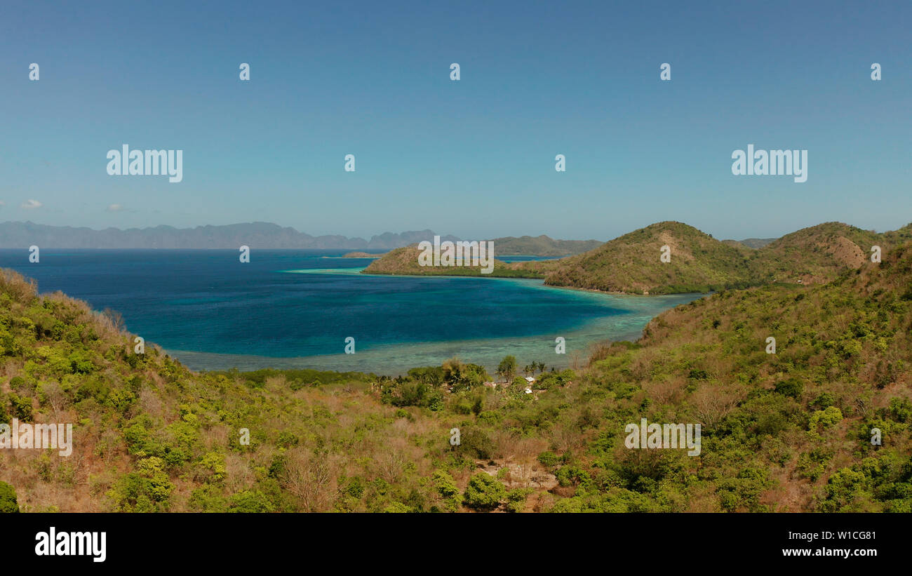 aerial drone tropical islands with blue lagoons, coral reef and sandy ...