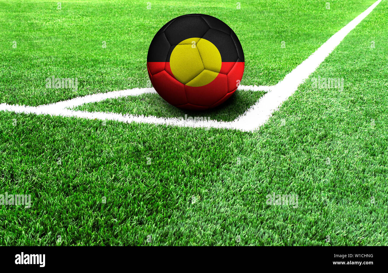 soccer ball on a green field, flag of Australian Aboriginal Stock Photo ...