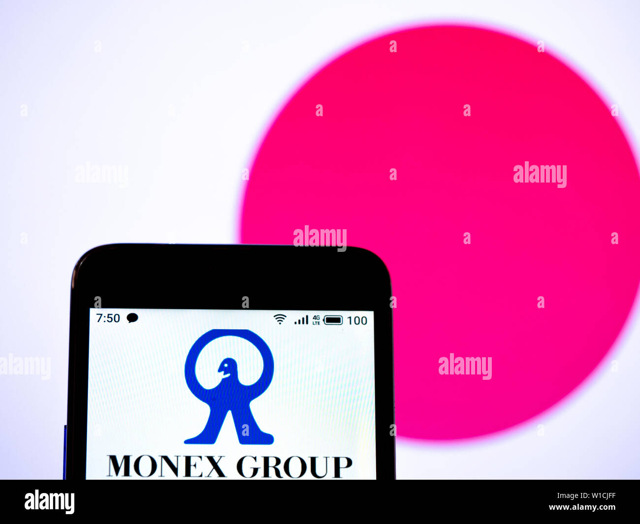 In this photo illustration the Monex Group, Inc. logo is seen displayed ...
