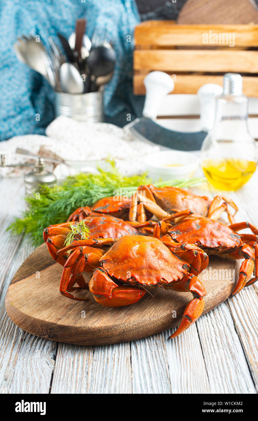 Cooked crab on wooden board/ Seafood boiled red stone crab with spices ...